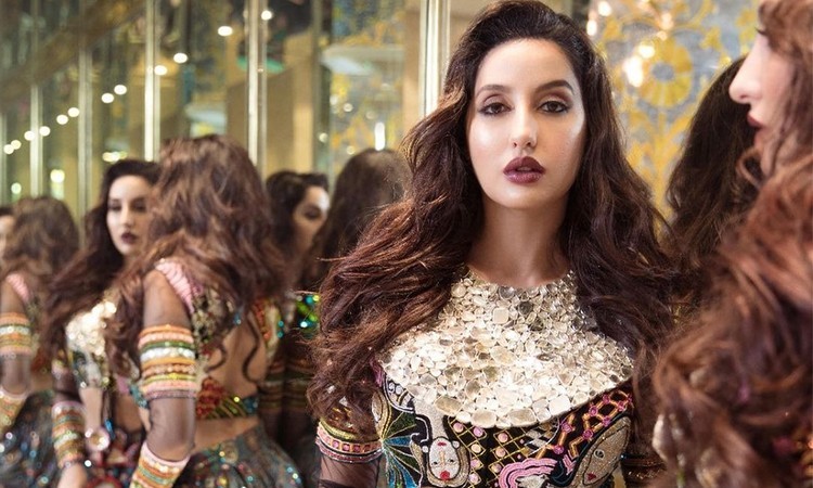 Nora Fatehi makes way to netizens’ hearts with her latest fierce red ...